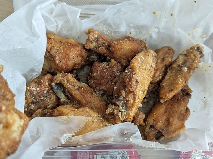 These wings aren't just crispy – they're the kind that make you involuntarily close your eyes with each bite, momentarily forgetting you're in public.