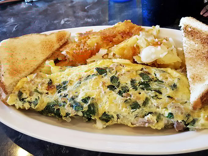 This isn't just an omelet—it's a garden party wrapped in eggs. The spinach and cheese create a breakfast symphony worthy of a standing ovation.