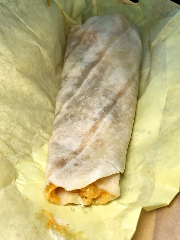 This burrito isn't just wrapped, it's embraced by a perfectly griddled tortilla—the kind that makes you pause before the first heavenly bite.