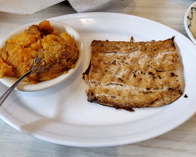 Grilled salmon meets sweet potato casserole in a delicious duet that proves this cafe isn't just about traditional Southern fare—it's about doing everything right.