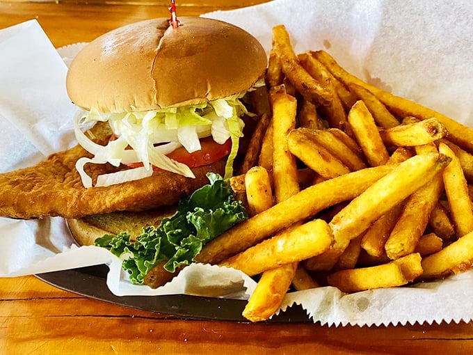 This grouper sandwich doesn't need fancy frills—just perfectly fried fish, fresh toppings, and golden fries that'll make you forget all about your diet plans.
