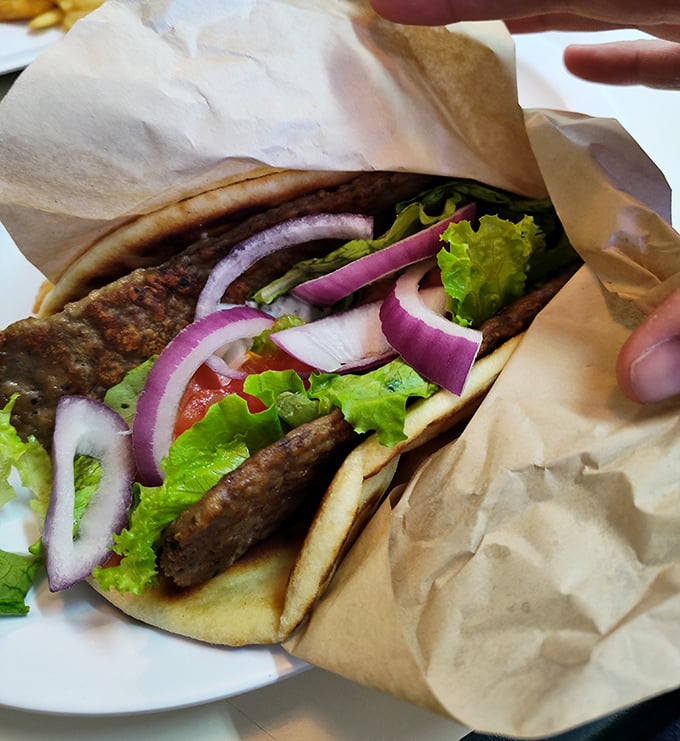 The gyro – where Erie meets Athens in a perfect handheld vacation. Fresh, vibrant, and requiring strategic bite planning.
