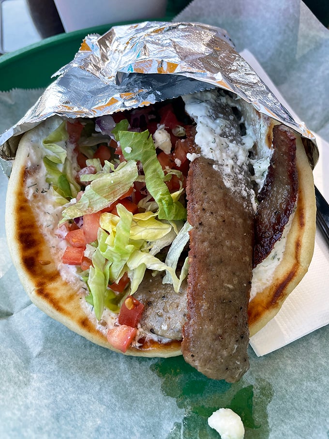 This gyro isn't just a sandwich, it's a Mediterranean vacation wrapped in warm pita – fresh, vibrant, and ready for its close-up.