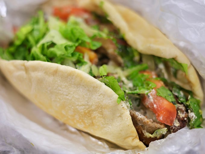 A proper gyro should require strategic eating and at least three napkins. This beauty, bursting with fresh greens and tender meat, checks all the boxes.