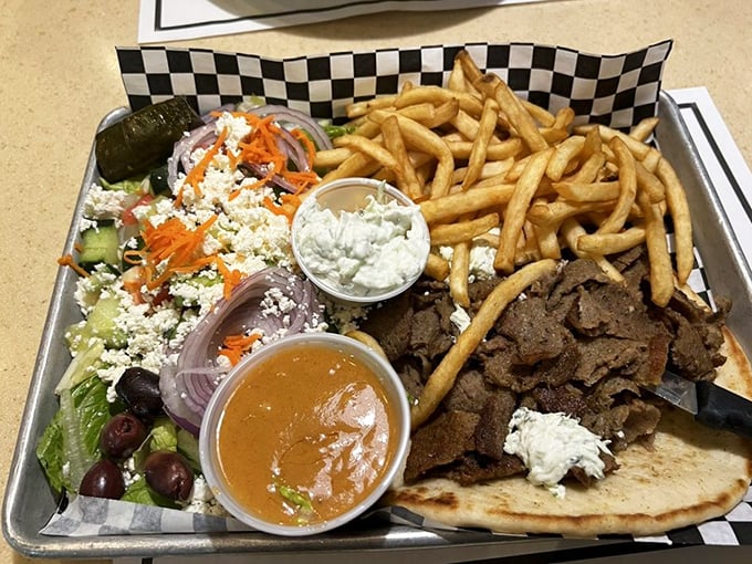This isn't just a gyro platter—it's a Mediterranean vacation on a metal tray. The feta-topped Greek salad plays perfect wingman to seasoned meat.