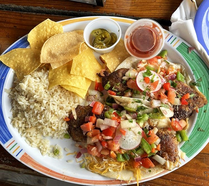 These fish tacos aren't just a meal, they're a tropical vacation for your taste buds—fresh pico de gallo and island spices dancing atop perfectly seasoned fish.