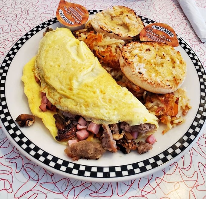Breakfast perfection doesn't exi— Oh wait, it does! This fluffy omelet with all the fixings and golden hash browns would make morning people of us all.