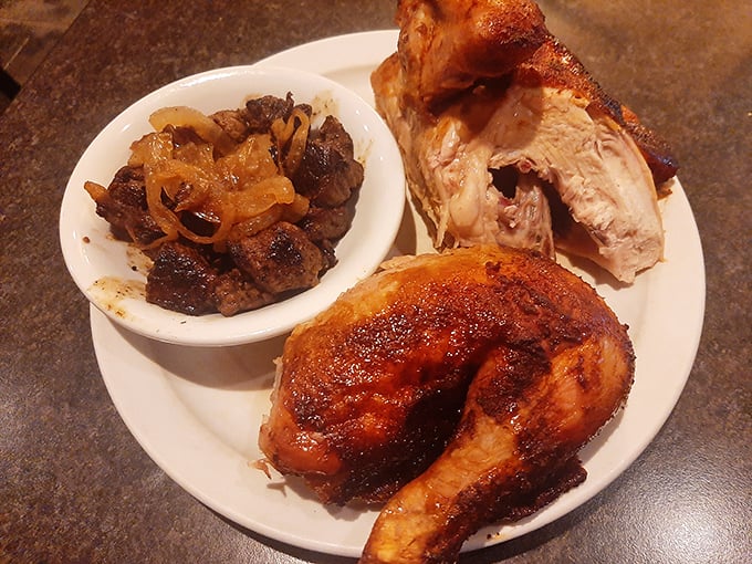 The honey-glazed chicken arrives like a caramelized work of art, accompanied by chopped sirloin that's been properly introduced to caramelized onions.