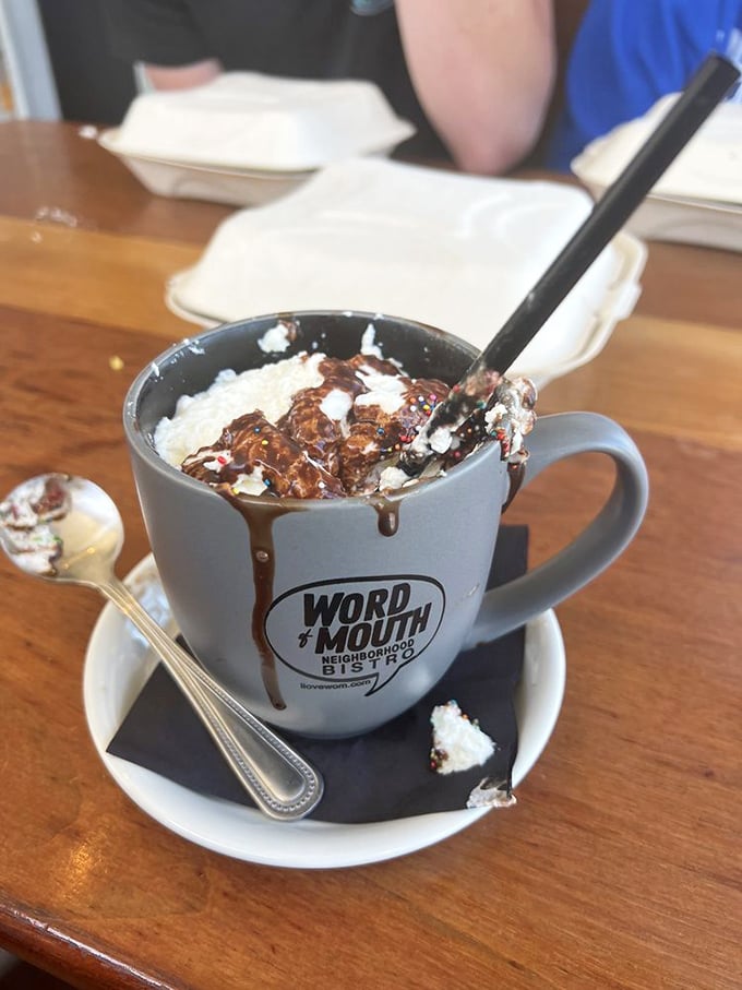 Hot chocolate that requires a commitment. This isn't a beverage—it's dessert in disguise, complete with whipped cream islands slowly sinking into chocolatey bliss.