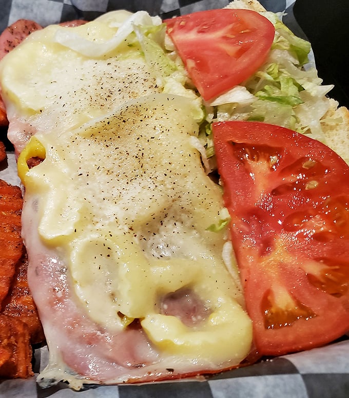 This isn't just a sandwich; it's architecture—layers of meat, cheese, and fresh veggies creating the skyscraper of lunch options.