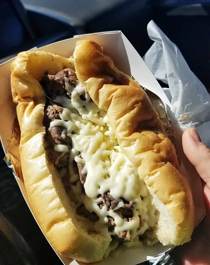The Italian beef sandwich – where thinly sliced, seasoned beef meets its destiny in a marriage of juicy perfection that requires strategic napkin deployment.