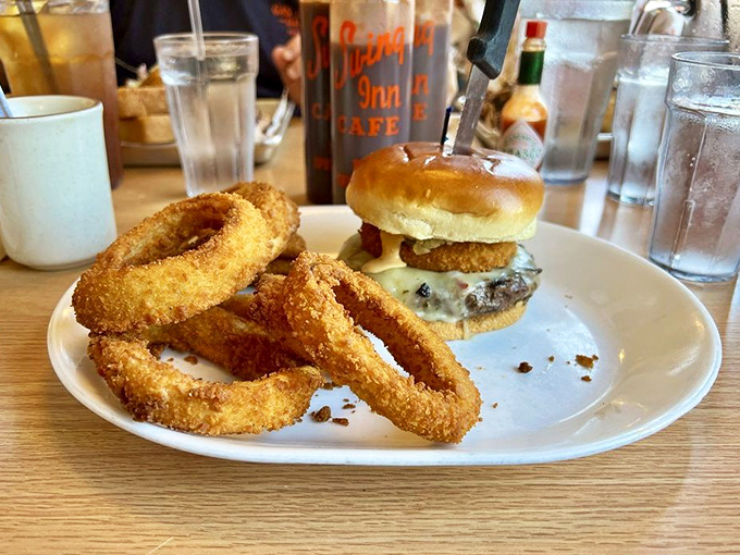 The perfect burger-to-onion-ring ratio exists, and it's right here—a juicy patty and golden rings that make you wonder why you'd eat anything else.