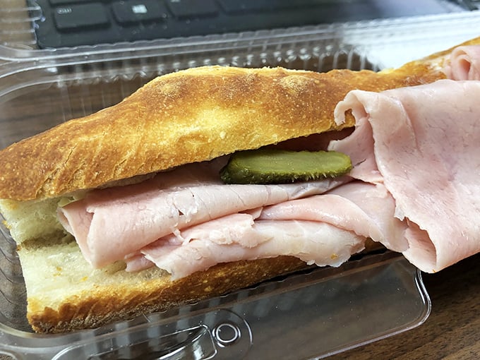 The humble ham sandwich achieves its highest form here. Crusty baguette, generous ham, and the crucial cornichon pickle—simplicity that would make a Frenchman weep.