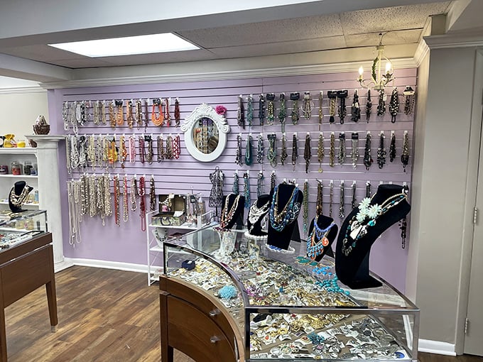 The jewelry display transforms forgotten accessories into tomorrow's statement pieces. That purple wall could be hiding your next conversation starter.