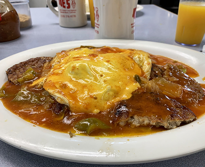 The John Wayne Special doesn't ask permission to be delicious—it commands your plate with eggs, steak, and a sauce that could make a cowboy weep.