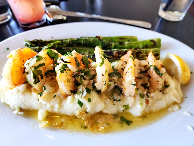 Plump shrimp lounging on a bed of creamy mashed potatoes with asparagus standing at attention—comfort food that got dressed up for a night out.