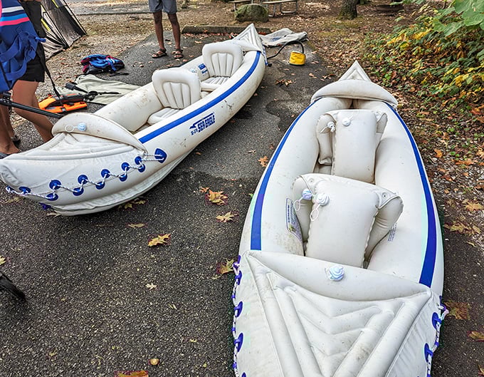 Inflatable kayaks lined up like colorful pastries in a bakery window, each promising a different flavor of lake adventure.