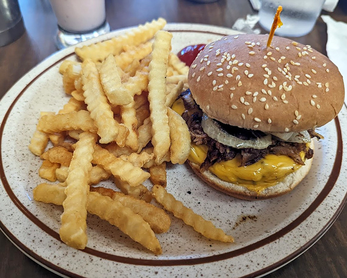 This isn't just a burger – it's the Cowboy Burger architecture at its finest, where every bite delivers the perfect ratio of beef, cheese, and those gloriously crispy fries.