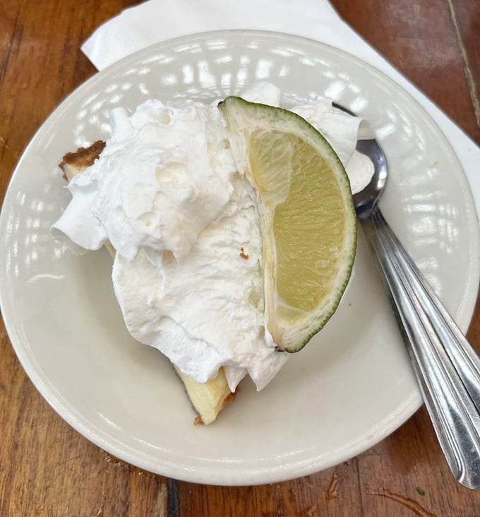Key Lime pie so authentic it should come with a certificate – cloud-like meringue, tart filling, and that essential lime wedge for Instagram-worthy proof.