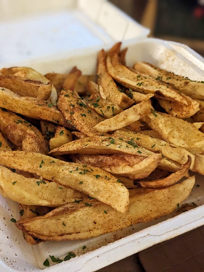 These aren't just fries—they're potato sculptures dusted with seasoning that would make your spice rack jealous. Worth every delicious calorie.
