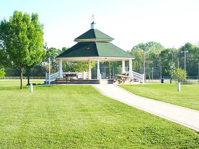 The gazebo at Lions Park has witnessed countless summer concerts, first kisses, and community gatherings—a white-painted time machine to simpler pleasures.