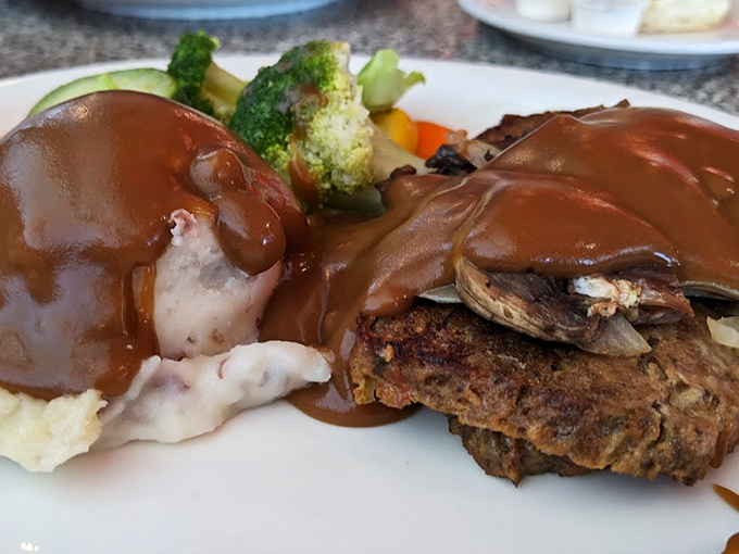 Comfort food doesn't get more soulful than this meatloaf smothered in rich gravy, where each bite transports you to a simpler time.
