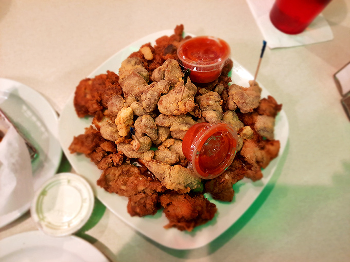 These aren't your average appetizers. The mountain of golden-fried gizzards comes with dipping sauce that makes even organ meat skeptics reconsider their life choices. 