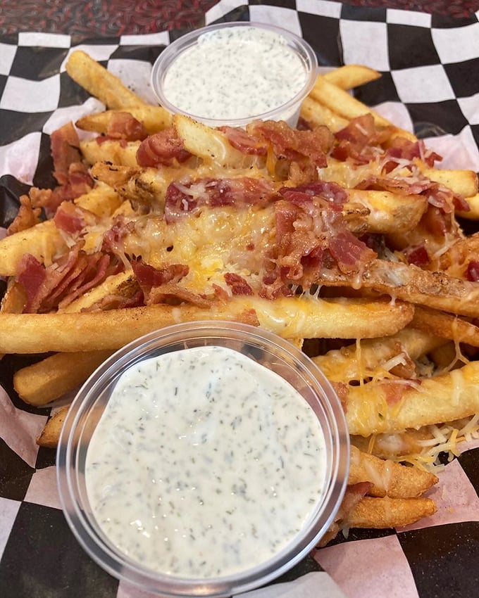 These loaded fries aren't just a side—they're a main event with bacon, cheese, and ranch dressing performing a flavor concert on your taste buds.