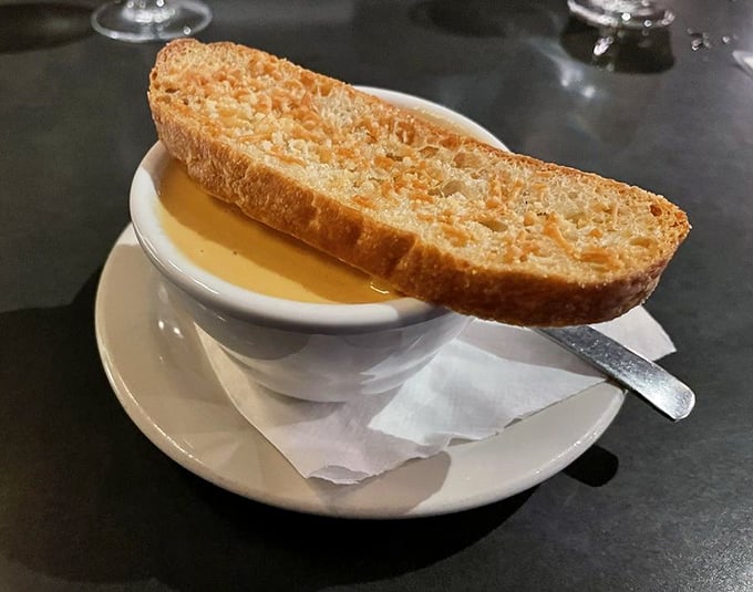 This isn't just soup with bread—it's lobster bisque with purpose, the kind that makes you consider drinking straight from the bowl when nobody's looking.