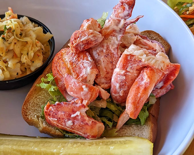Lobster roll heaven! Chunks of sweet meat nestled in a perfectly toasted bun – the kind of sandwich that makes you consider moving to Maine.
