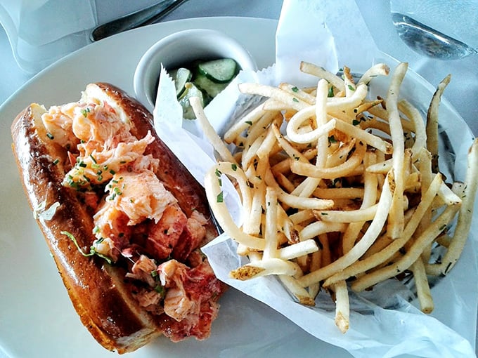 The lobster roll that launched a thousand road trips. Sweet Maine lobster meat nestled in a buttery roll with perfectly crisp fries—simplicity that speaks volumes. 