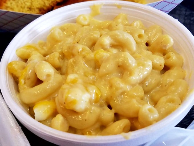 Mac and cheese that doesn't just accompany the meat but demands equal billing—creamy, golden, and unapologetically comforting.