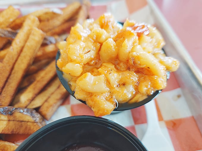 Mac and cheese that doesn't mess around—each creamy, golden bite is a cheese-pull waiting to happen. Comfort food elevated to art form.