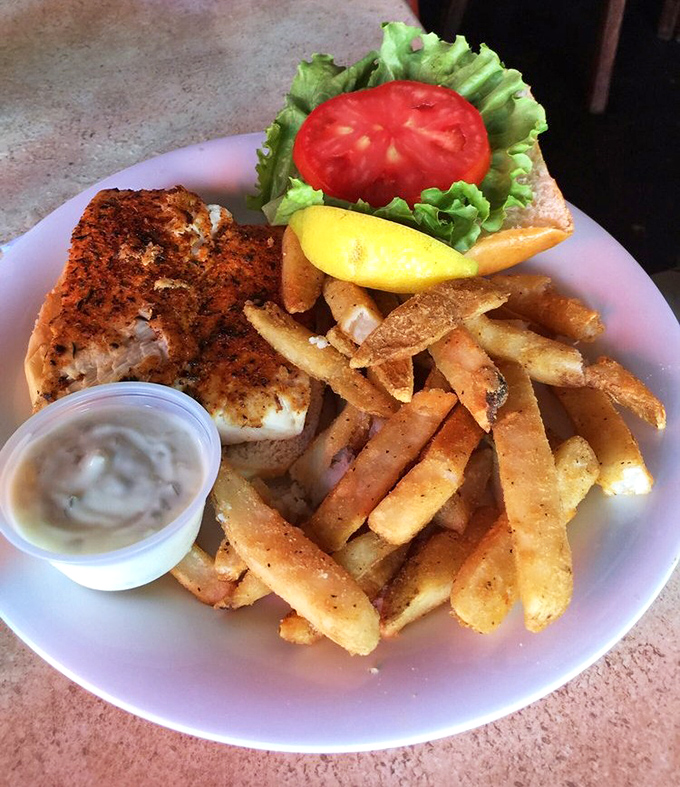 Blackened fish sandwich with fries—the beach vacation your taste buds have been dreaming about. Simple perfection that needs no fancy explanation.