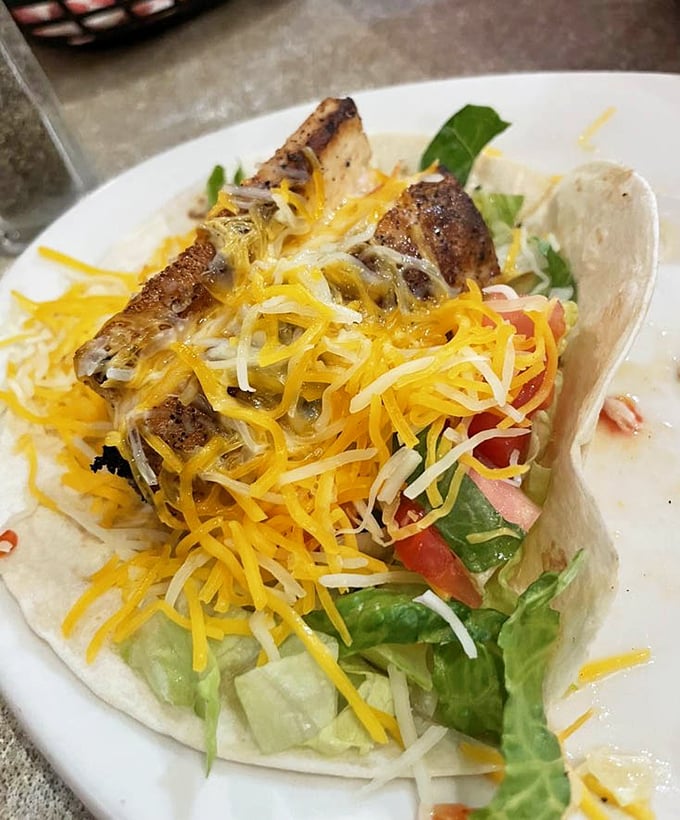 Who knew fish tacos could look so photogenic? That perfectly seared mahi-mahi is ready for its close-up with a supporting cast of fresh veggies.