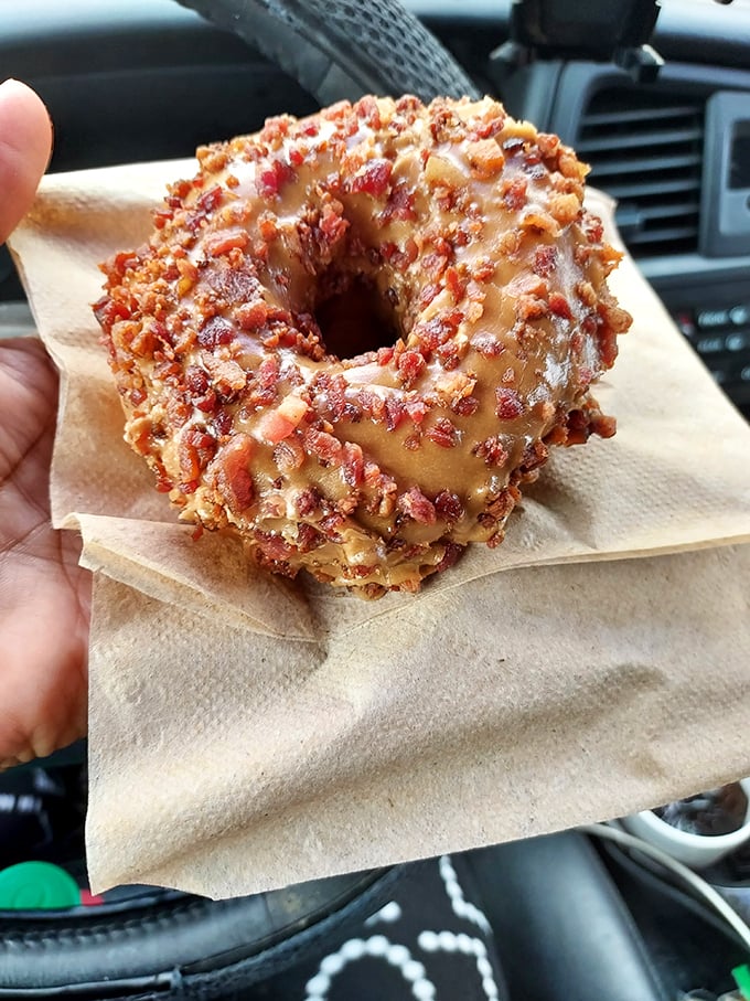 The maple bacon donut—where breakfast meets dessert in perfect harmony. Sweet, savory, and utterly irresistible in its simple brilliance.