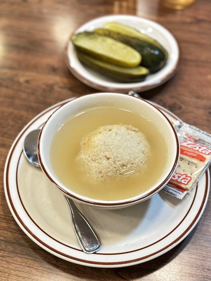 The matzo ball soup at Canter's—where penicillin meets poetry. That golden orb floating in clear broth has cured more ailments than modern medicine.