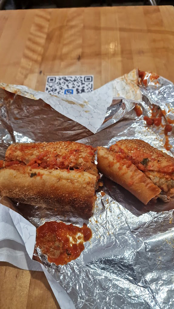 Not your nonna's meatball sub, but she'd approve anyway. The sesame-studded roll barely containing those saucy, perfectly-seasoned spheres of delight.
