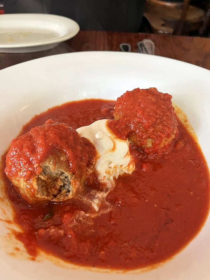 These meatballs swimming in rich marinara aren't just food—they're time machines to your Italian grandmother's kitchen, even if you never had one.