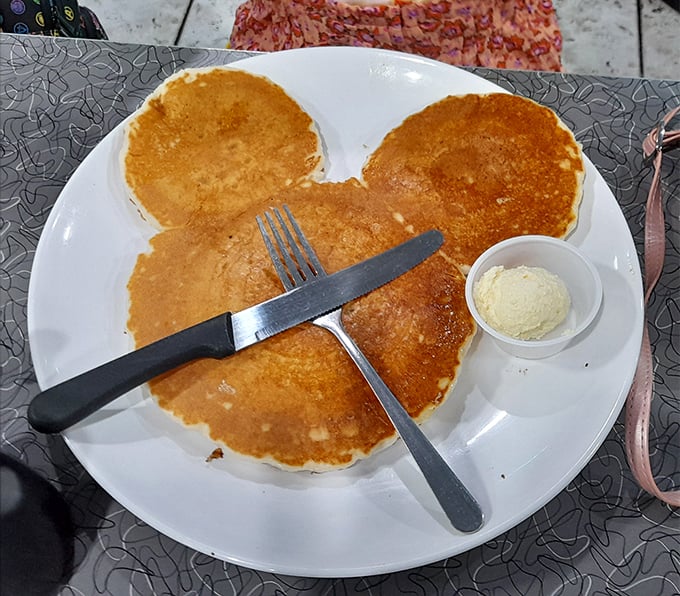 These pancakes aren't just breakfast, they're edible geometry – a perfect circle formation that makes your inner child and hungry adult equally happy.