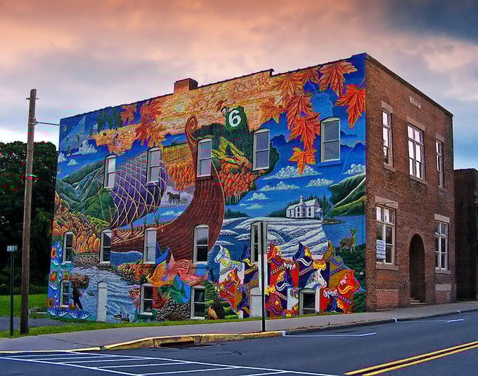 Mount Jewett's spectacular heritage mural transforms a simple brick building into a vibrant canvas celebrating the town's Swedish roots and natural splendor.