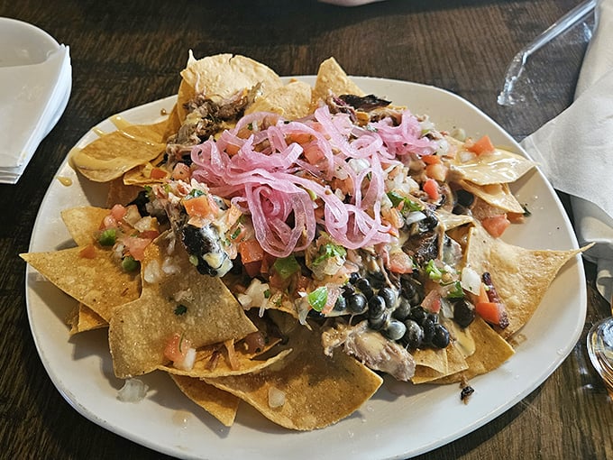 Nachos reimagined with smoky goodness and those pickled red onions on top? That's not a garnish—it's the crown jewel of this crunchy kingdom.