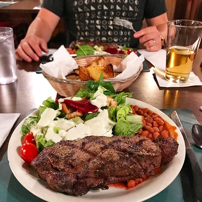 The New York steak arrives with perfect cross-hatched grill marks that would make a geometry teacher proud and a meat lover speechless.