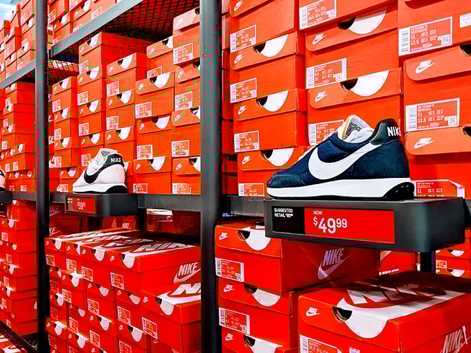 The wall of orange Nike boxes might as well be Fort Knox for sneakerheads. That $49.99 price tag is the real MVP.
