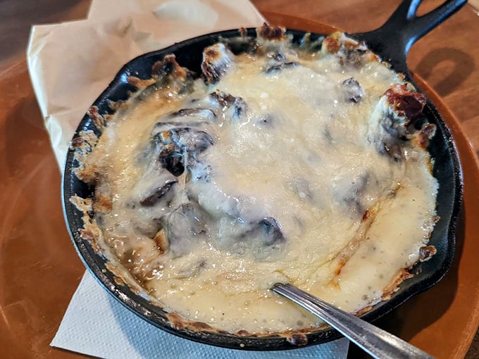 The Oaxaca Fundido arrives bubbling with molten cheese and roasted goodness. Resistance is futile—your tortilla is merely the delivery vehicle for this volcanic delight.