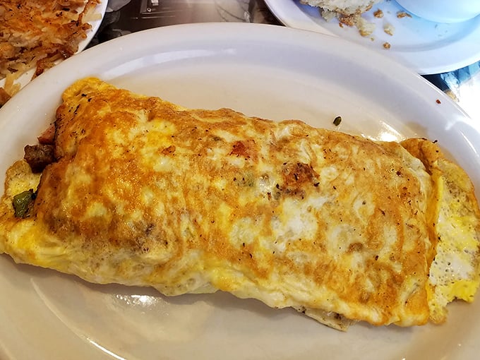 This isn't just an omelet; it's a masterclass in how eggs should be treated—with respect, proper technique, and generous fillings.