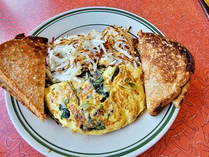 This isn't just an omelet—it's a fluffy envelope delivering a personal letter of deliciousness straight to your taste buds.
