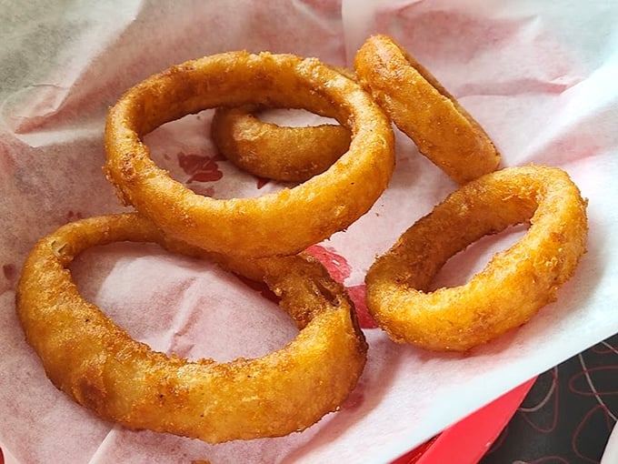 These onion rings aren't just fried to golden perfection—they're crispy halos that make you wonder why vegetables ever bothered being healthy.