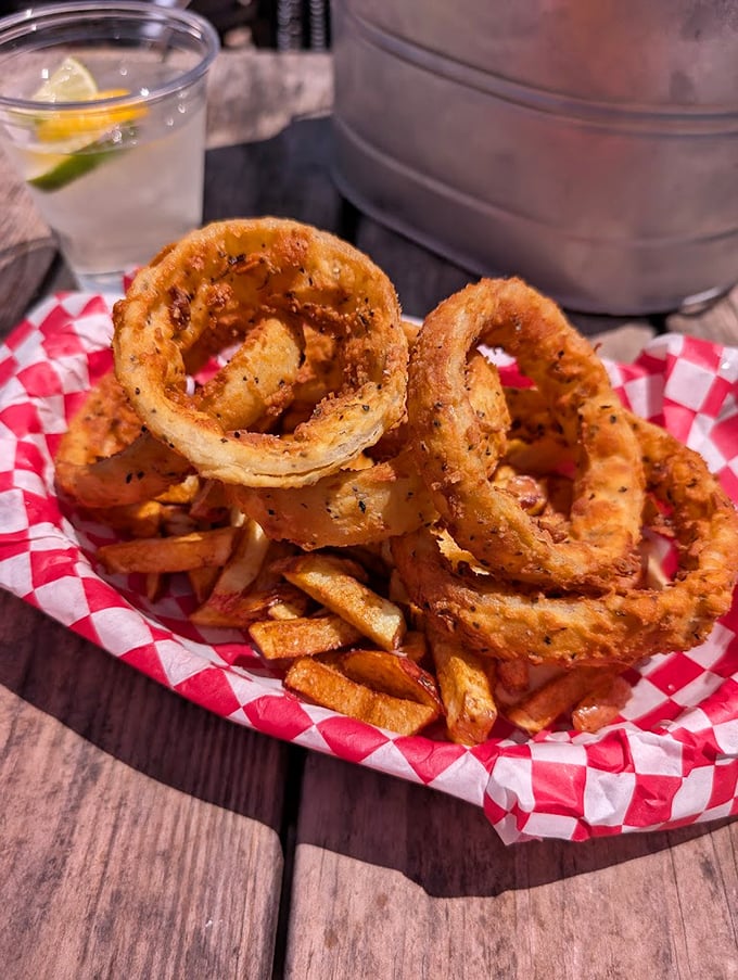 Golden onion rings that shatter with each bite, paired with hand-cut fries—proof that the supporting cast at Alamo Springs deserves their own standing ovation.