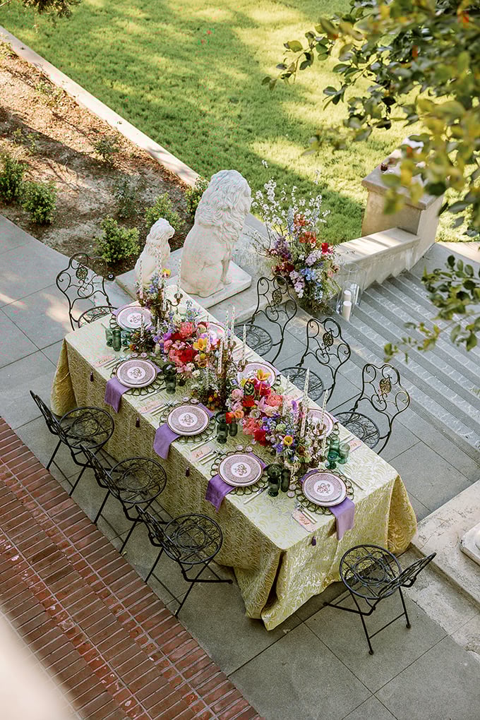Garden dining fit for royalty—or anyone who appreciates stone lions standing guard while they enjoy their avocado toast in paradise.